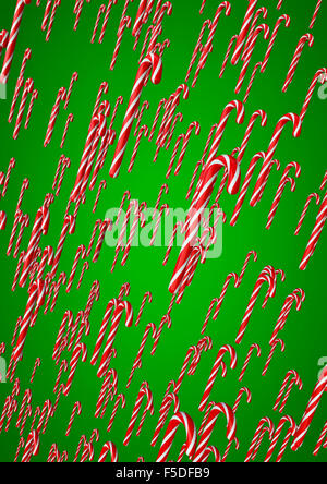 Red and white striped candy canes on a pink background. Christmas ...