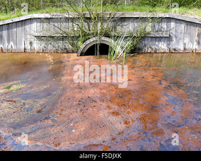 Water flow in polluted drainage stream in indian village with pipes ...