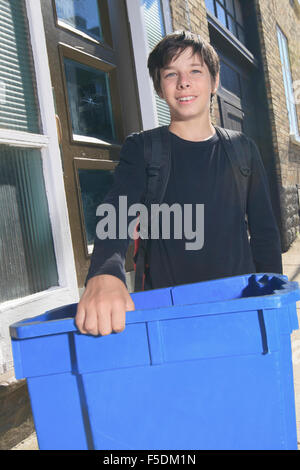Portrait, kid and container of recycle plastic for cleaning process ...