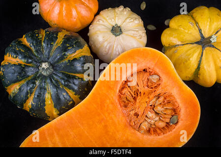 Autumn harvest concept, pumpkins background with yellow leaves, old ...