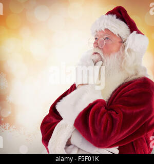Composite image of santa is thinking about something Stock Photo - Alamy