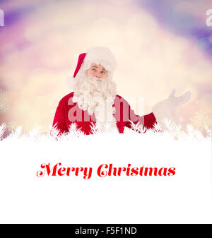 Composite image of father christmas with his hands out Stock Photo - Alamy