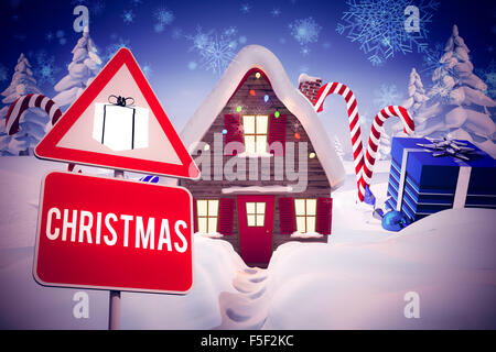 Composite image of christmas road sign Stock Photo - Alamy