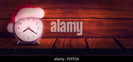 Composite image of christmas clock Stock Photo - Alamy