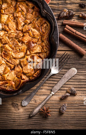 Fresh baked classic American apple pie on dark wooden background. Top ...
