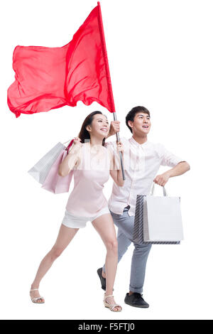 Young couple shopping with a red flag Stock Photo - Alamy