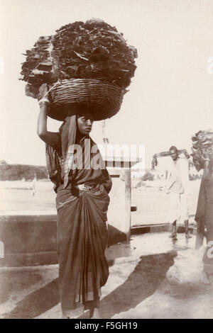 Bearer with pack on his head , India Stock Photo - Alamy