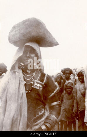 Bearer with pack on his head , India Stock Photo - Alamy