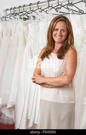 Female Owner Of Bridal Wedding Dress Shop With Digital Tablet Stock ...