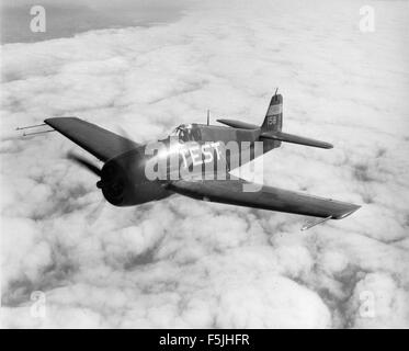 A Grumman F6F-5 Hellcat is shown in a close-up air-to-air view during ...
