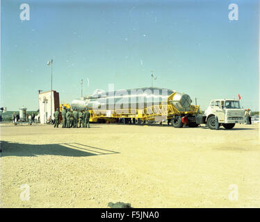 This image shows the Atlas missile being transported by a C-133 ...