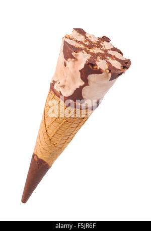 Ice cream vanilla cone coated with chocolate layer and nuts in a crispy ...