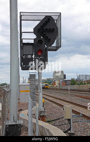 A new LED train signal displaying a yellow proceed aspect along the ...