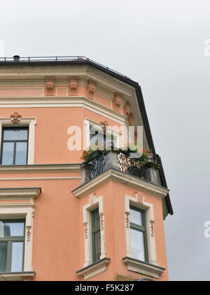 Classic style balcony with flowers at summer time Stock Photo - Alamy