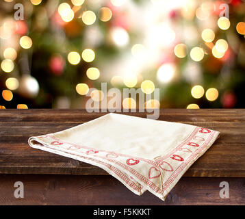 wooden christmas decoration against defocused garland lights background ...