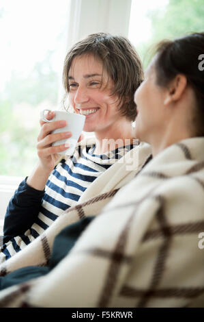 Two women having coffee Stock Photo - Alamy