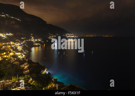 Night time panorama of Positano lights and the Amalfi Coast, Italy ...