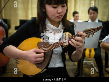 Kyrgyz authentic musical instruments orchestra play with conductor ...