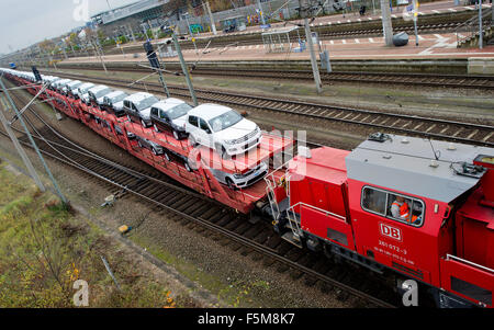 A freight train transports new cars of carmaker Volkswagen (VW) in ...