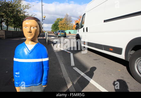 A life-like 'child bollard' on a pavement close to a school crossing ...