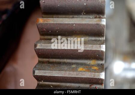 big old rusted flywheel closeup Stock Photo - Alamy