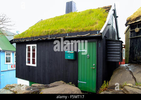Faroese traditional black tarred timber house with grass turf roof ...