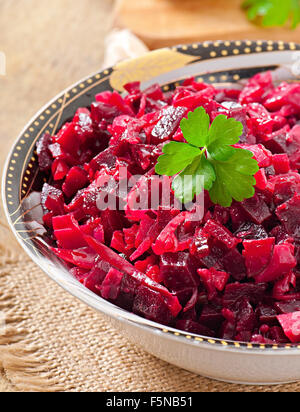 Traditional Russian beetroot salad, Vinaigrette, in white bowl on ...