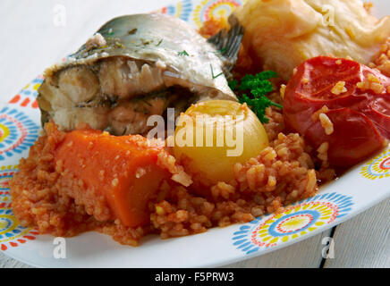 Thieboudienne - traditional dish from Senegal.made from fish, rice and ...
