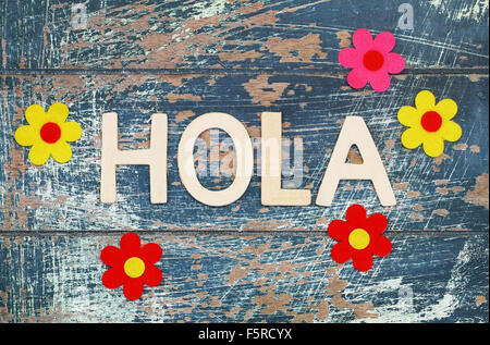 Hola (which means hello in Spanish) written with wooden letters on ...