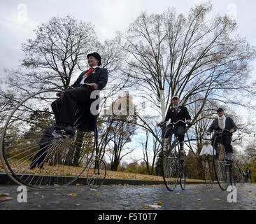 Velocipedists, men on historic bikes and in period costumes, pictured ...