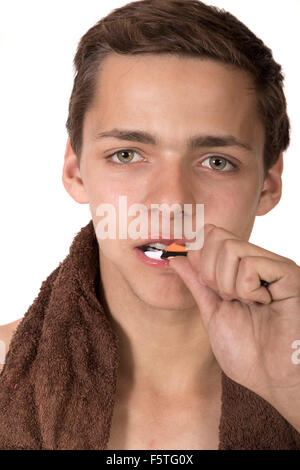 Teen boy brushing teeth Stock Photo - Alamy