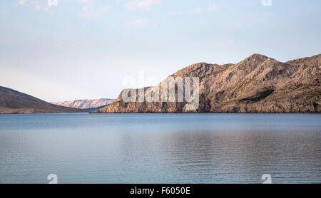 Sea lagoon enclosed by mountains Stock Photo - Alamy