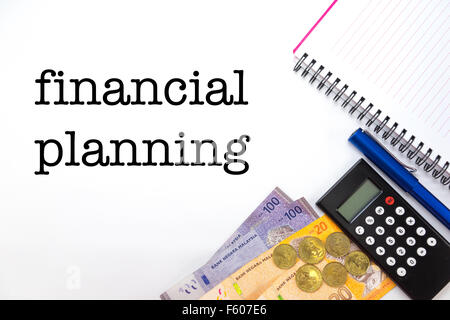 Notebook, calculator and money on color background Stock Photo - Alamy