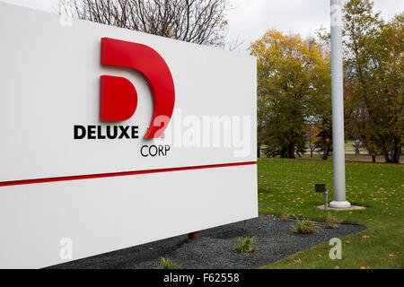 A logo sign outside of the headquarters of the Deluxe Corporation in ...