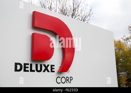 A logo sign outside of the headquarters of the Deluxe Corporation in ...
