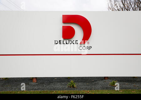 A logo sign outside of the headquarters of the Deluxe Corporation in ...