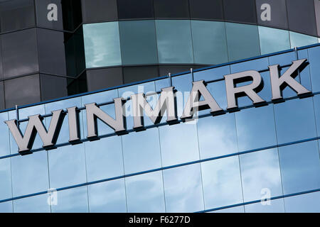 A logo sign outside of the headquarters of the Winmark Corporation in ...