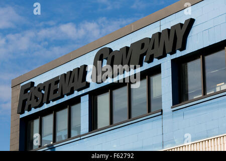 A logo sign outside of the headquarters of the Fastenal Company in ...