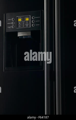 Modern refrigerator with frontal display control panel and ice ...