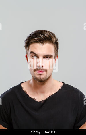 Portrait of young attractive handsome flirty man wink blink eye romance ...