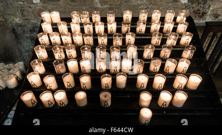 burning sacrificial candles in a church Stock Photo - Alamy