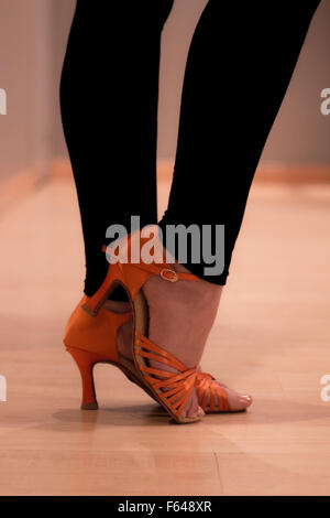 Close-up of ballroom dancers' feet in elegant black standard attire ...