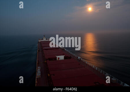 on a Laker Ship on the Great Lakes at night engine room view of main ...