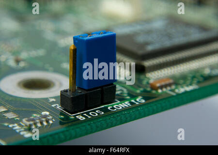 Computer motherboard circuit. Jumper BIOS config in the center Stock ...