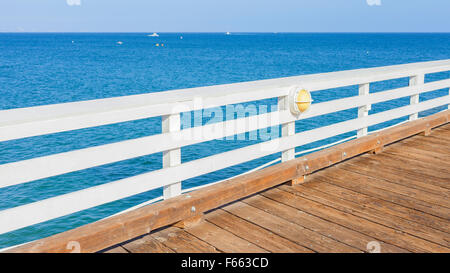 Wooden pier with blue sea and sky background Stock Photo - Alamy