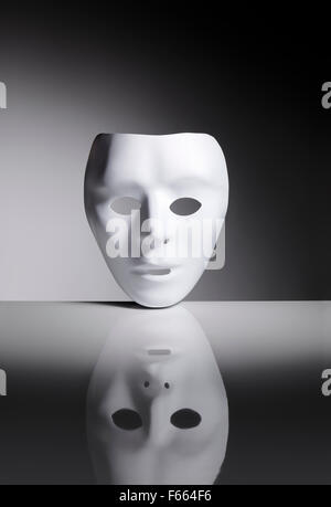 White plastic mask on reflective surface Stock Photo - Alamy