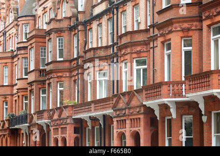 Row of houses with red brick building in Victorian style, district ...