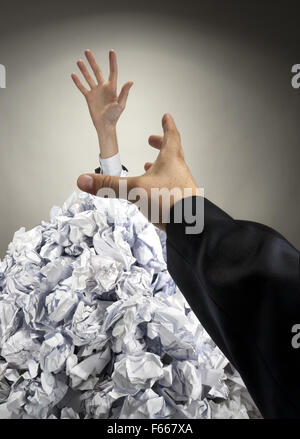 Businessman buried in big heap of crumpled papers Stock Photo - Alamy