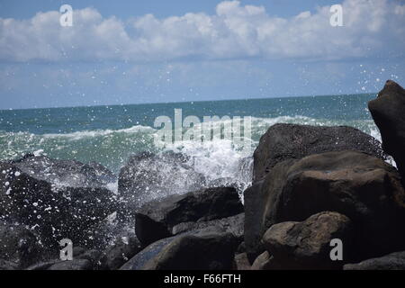Sea spray over Rocks Stock Photo - Alamy