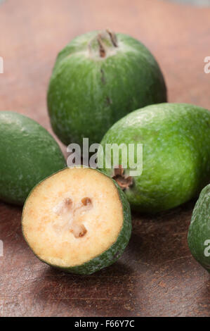 Feijoa berries on a timber board, closeup Stock Photo - Alamy
